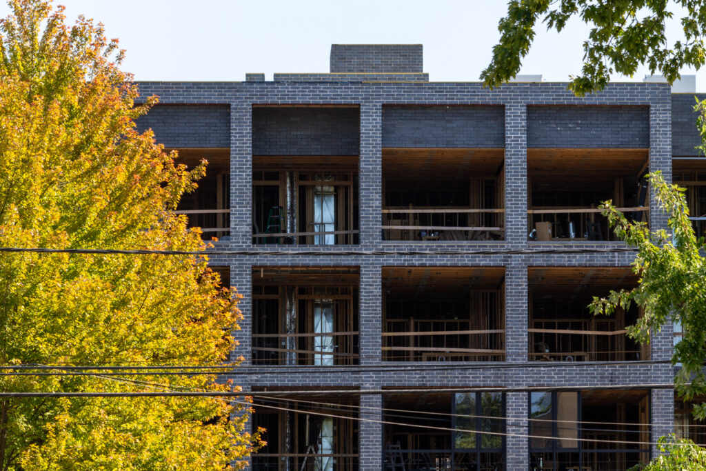 Glass installation in the early stages at topped-out 5753 North ...